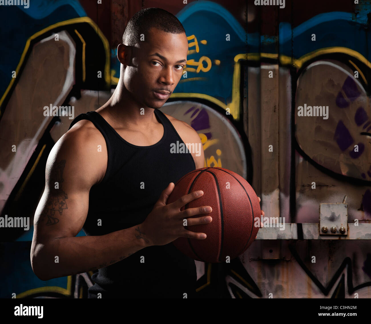 Portrait of young man with basketball Stock Photo - Alamy