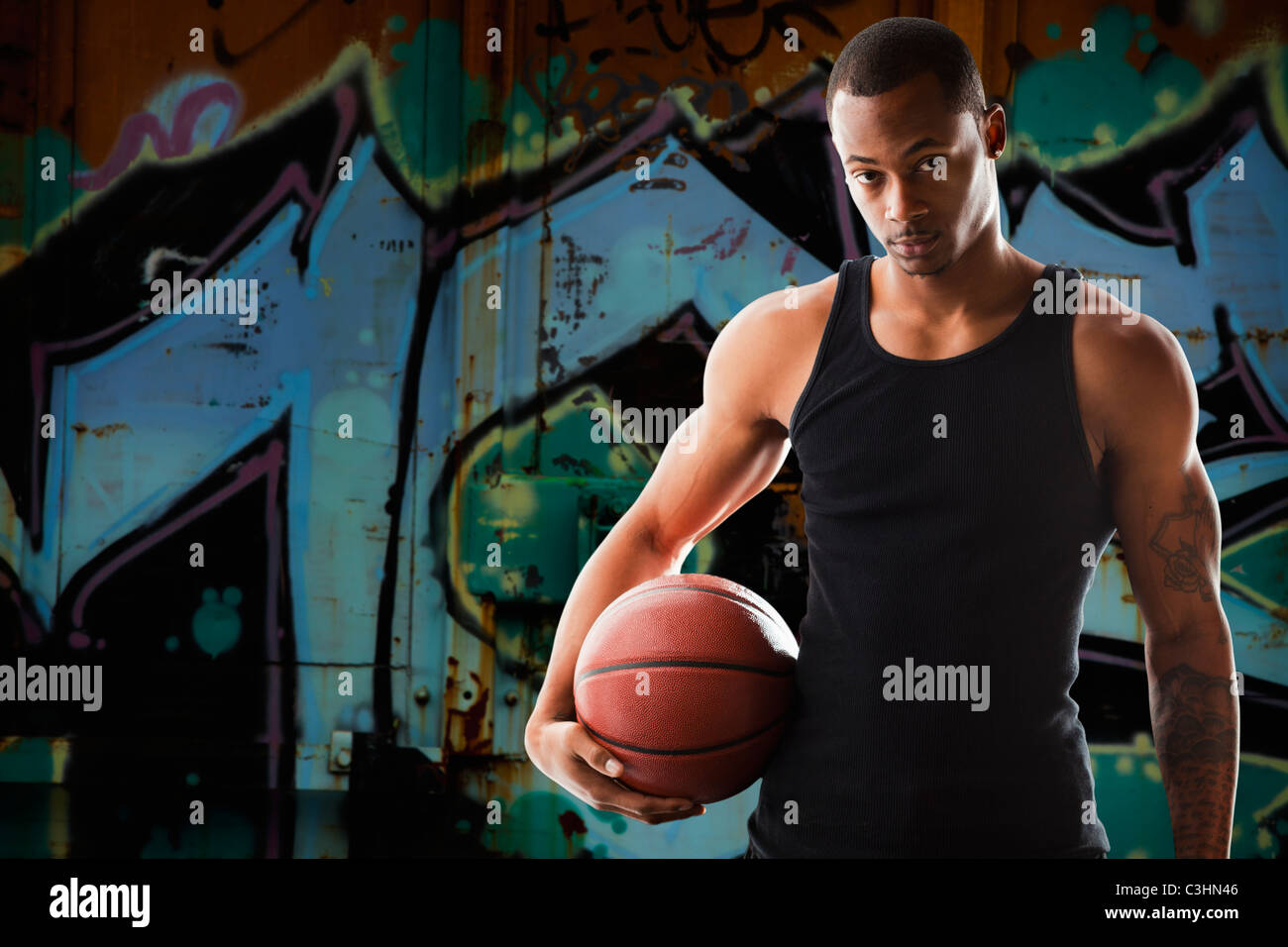Portrait of young man with basketball Stock Photo - Alamy