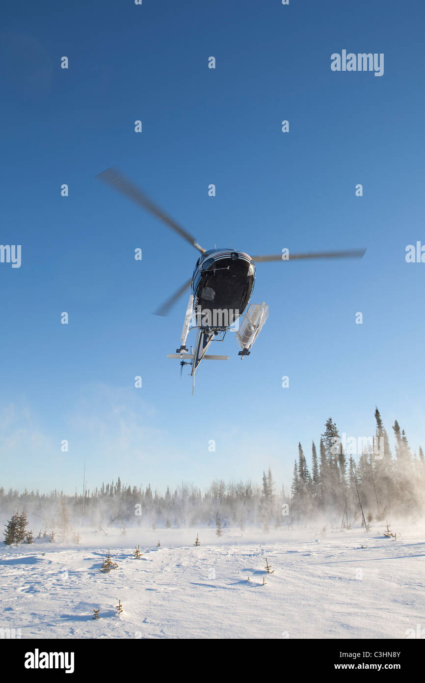 Helicopter landing on snow Stock Photo - Alamy