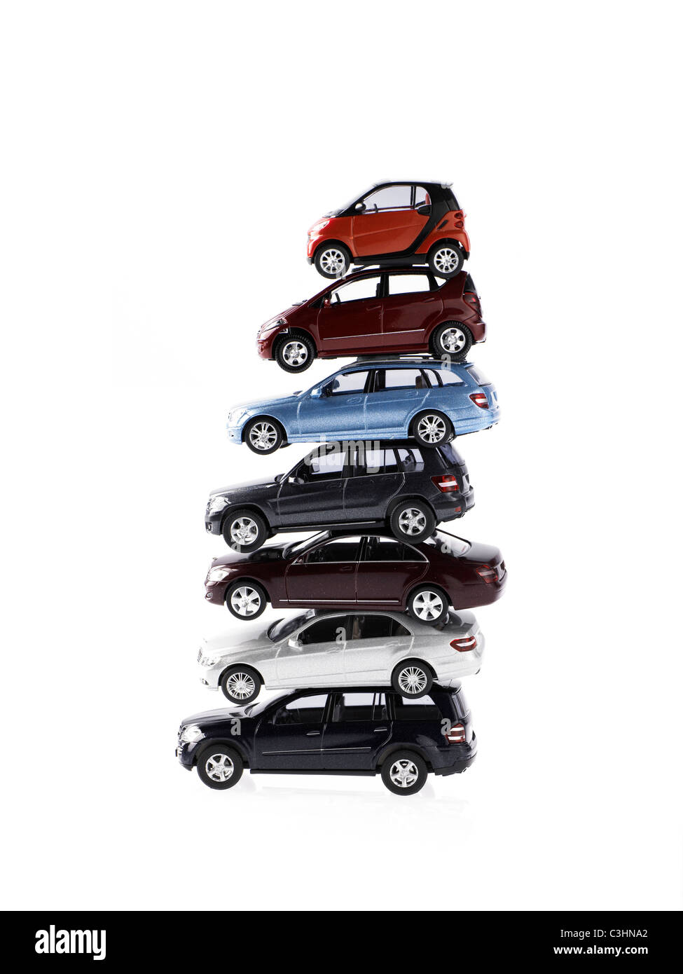 Stacked cars on white background Stock Photo - Alamy