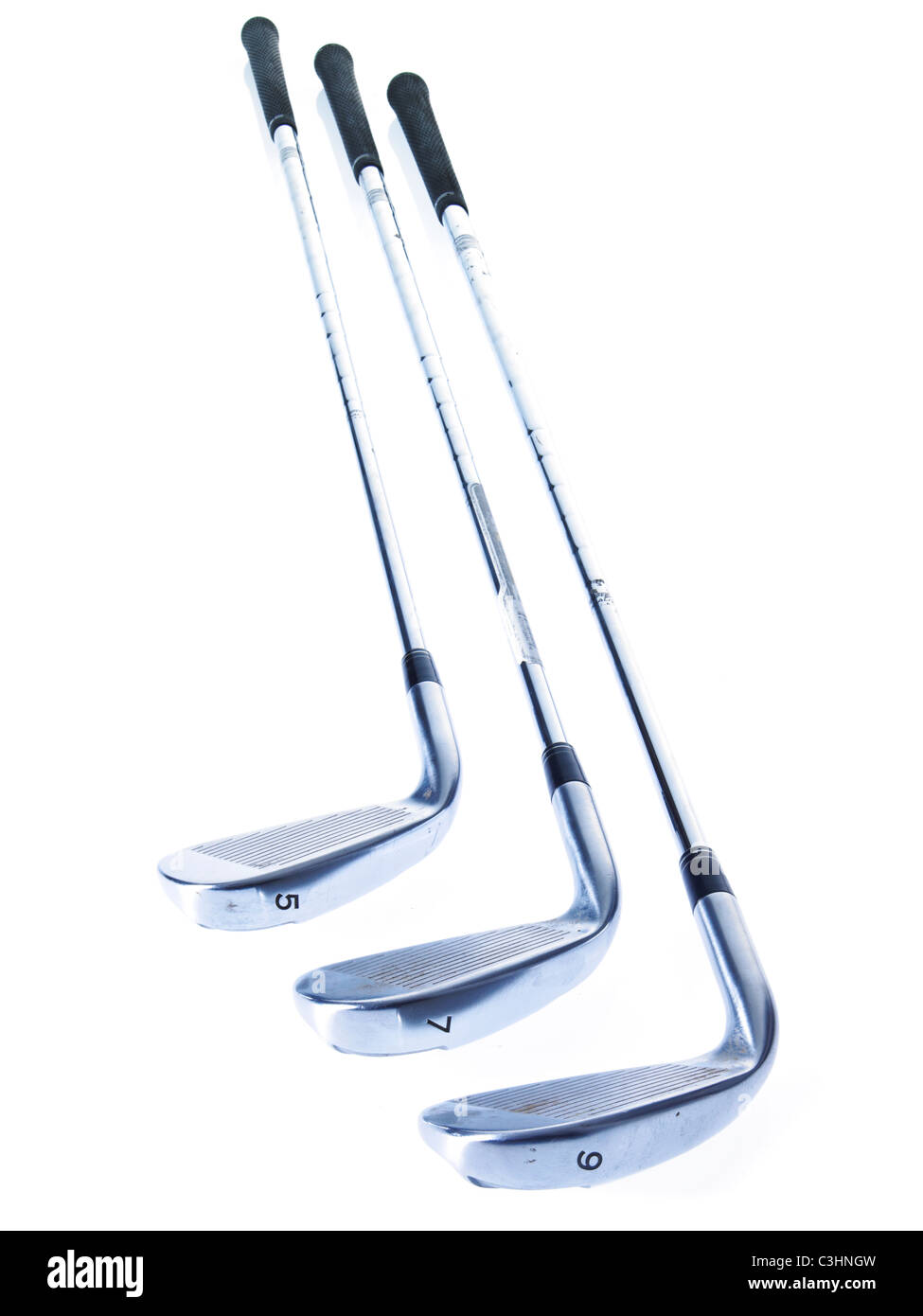 Three golf clubs on white background Stock Photo - Alamy