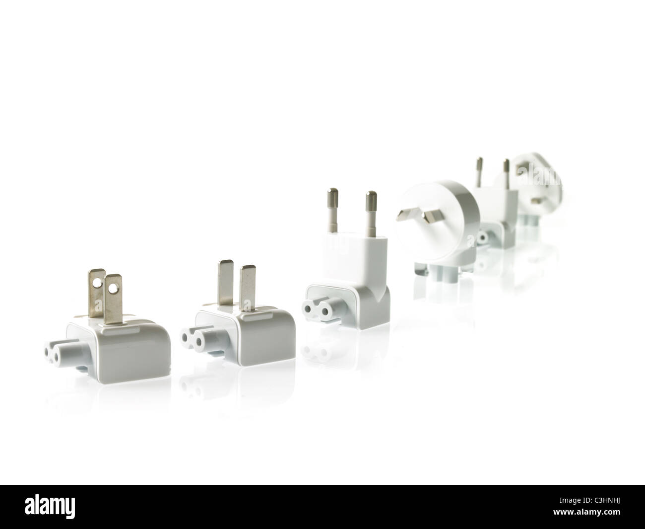 Row of plugs on white background Stock Photo - Alamy