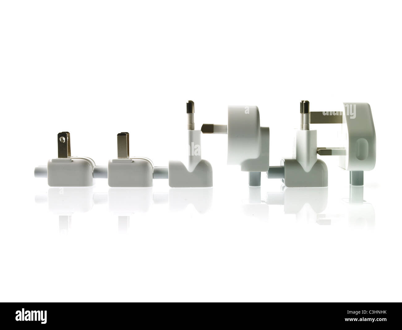 Row of plugs on white background Stock Photo - Alamy