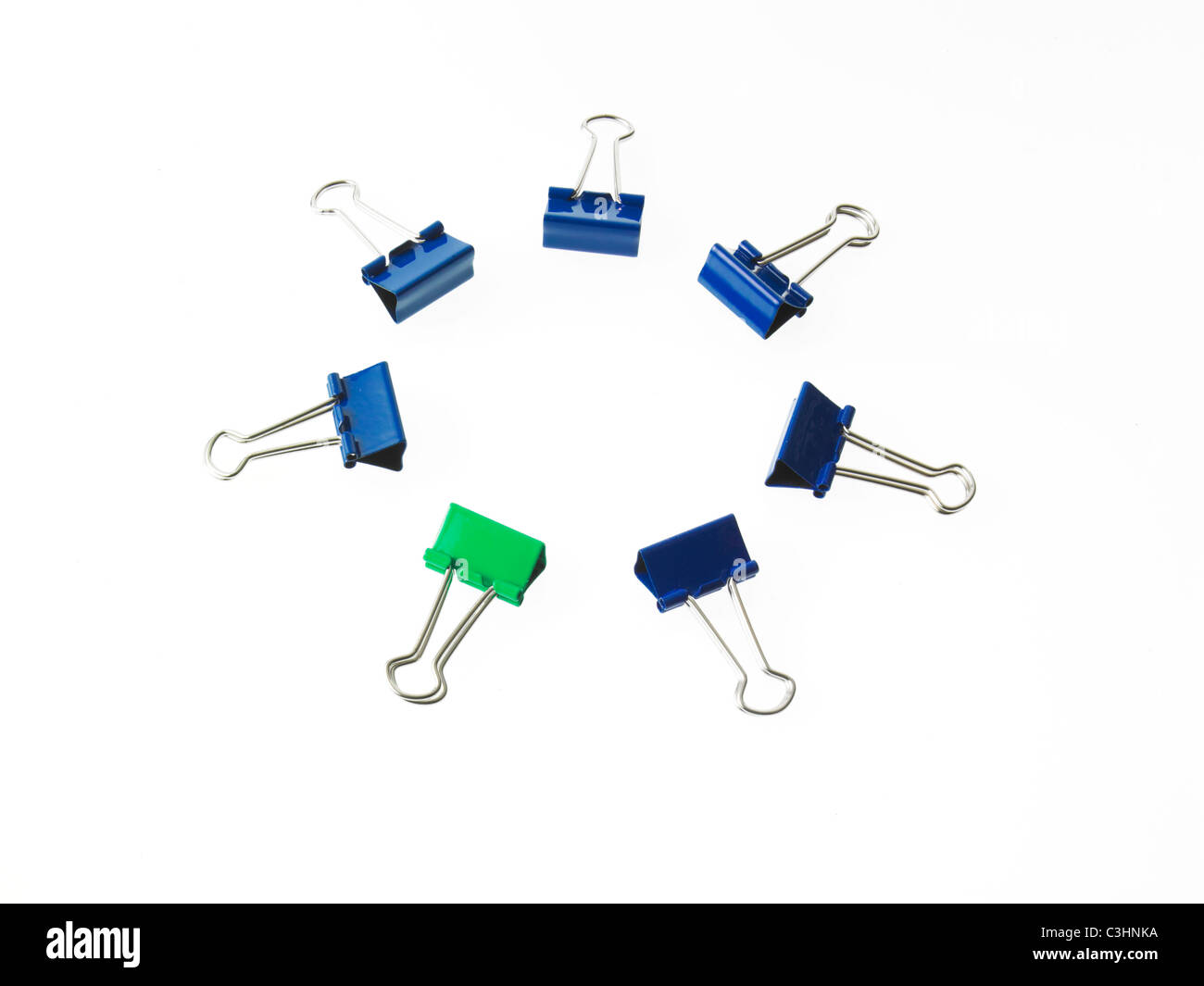 Blue and green bulldog clips on white background Stock Photo - Alamy