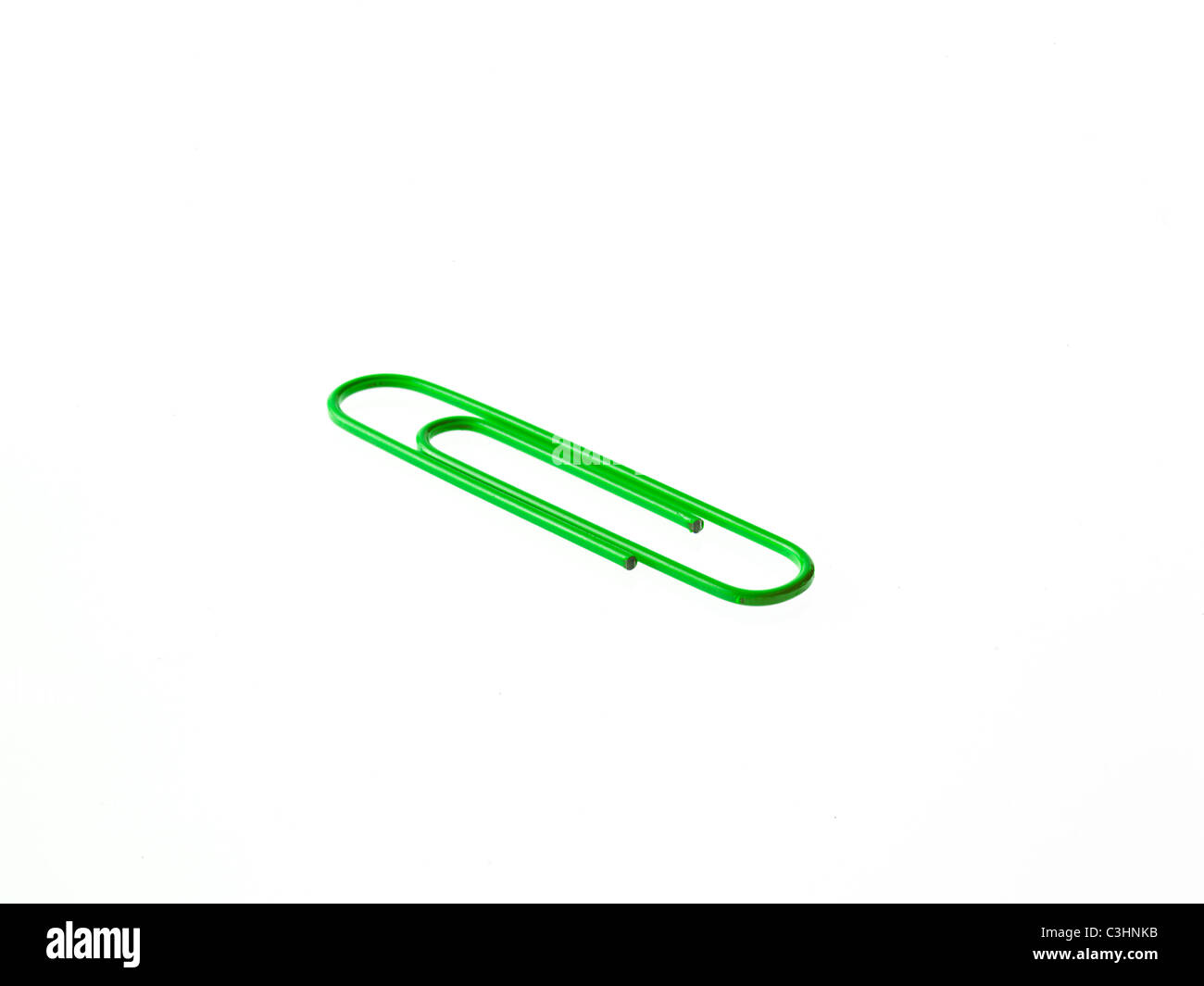 Green paper clip on white background Stock Photo - Alamy
