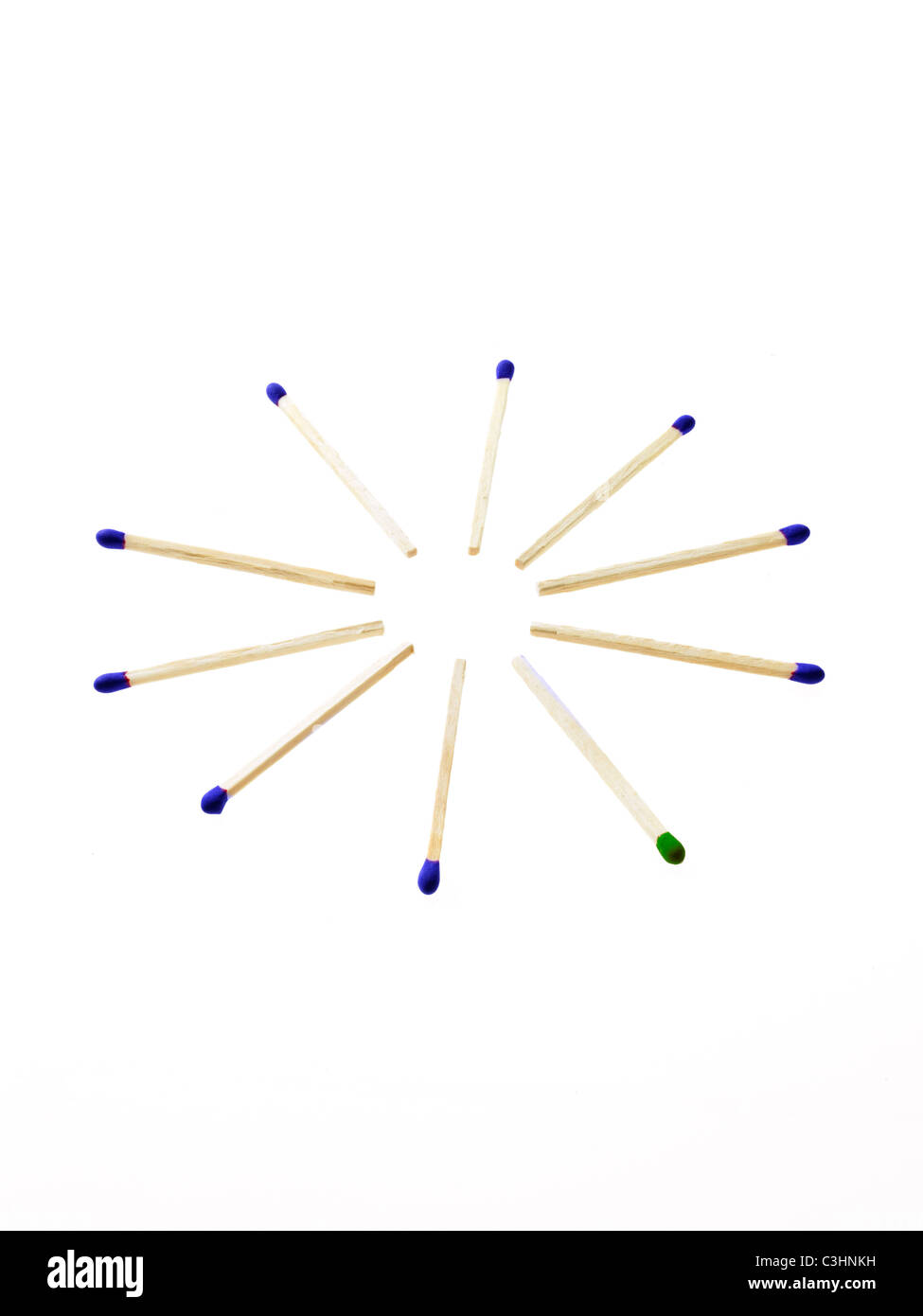 Blue matches with one green on white background Stock Photo - Alamy