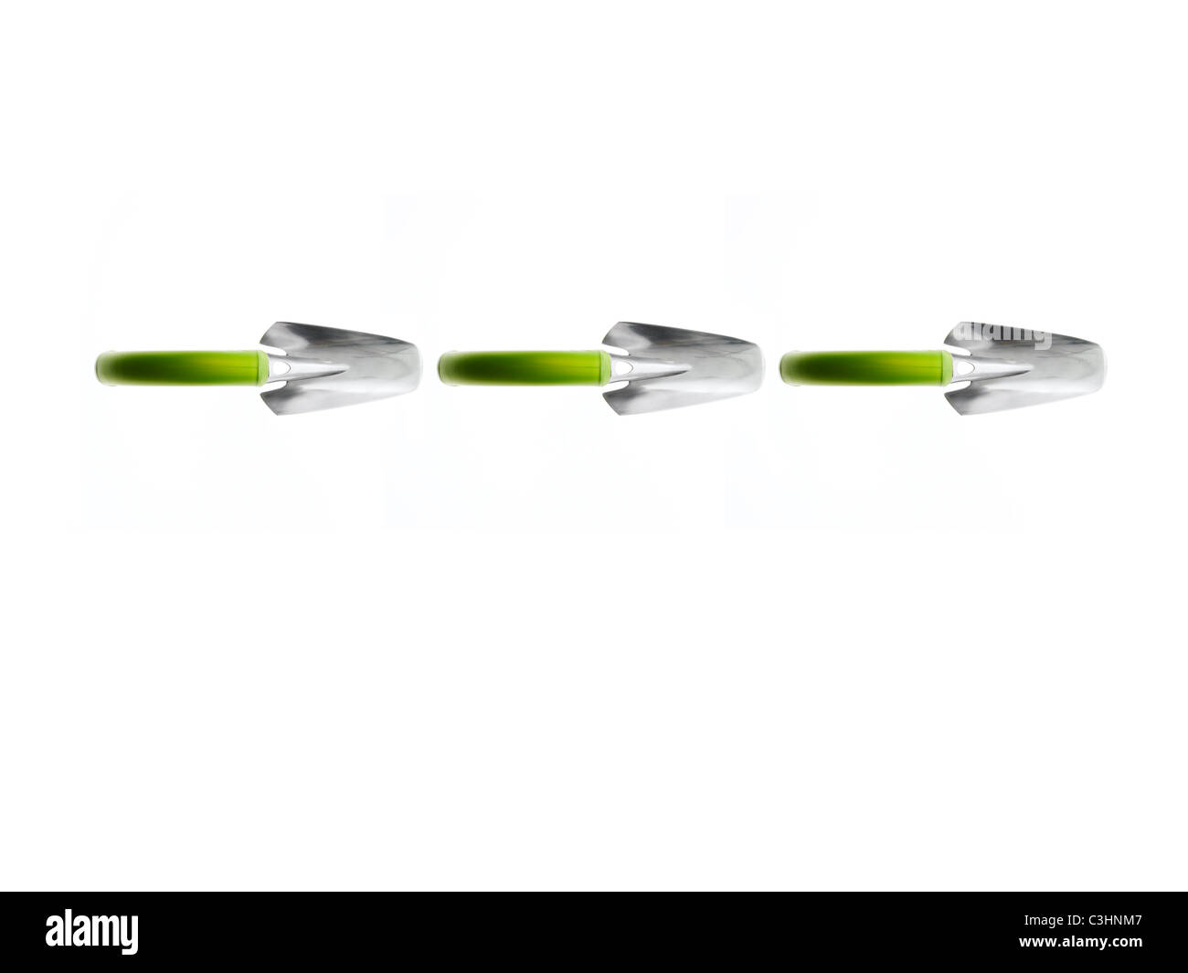 Studio shot of three spades in row Stock Photo - Alamy