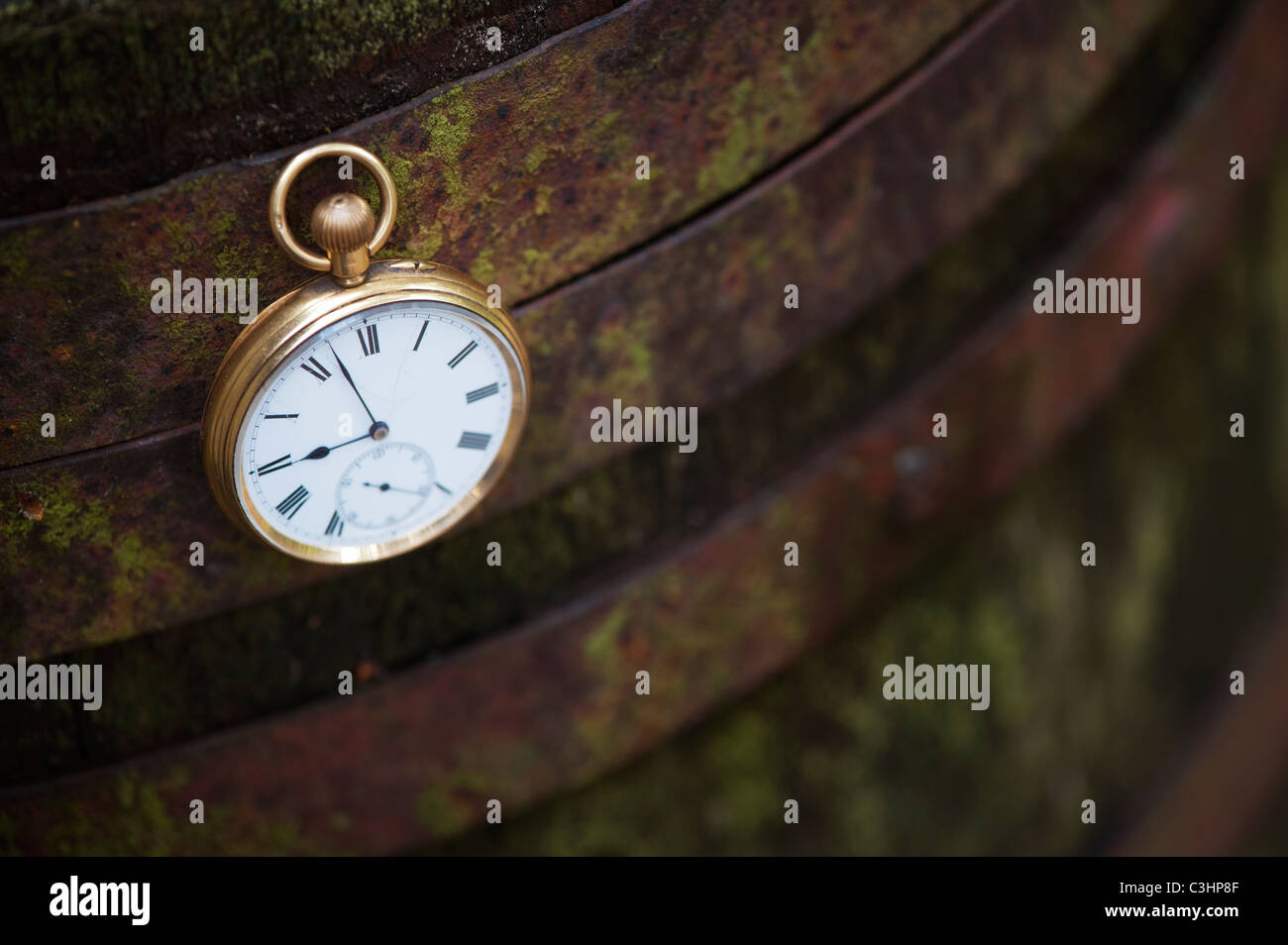 Old open face pocket watch and old oak rusty barrel Stock Photo - Alamy