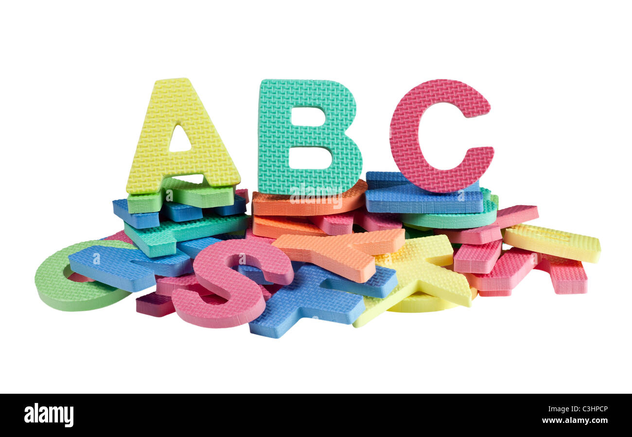 Pile of colorful alphabet blocks with A, B and C standing isolated on ...