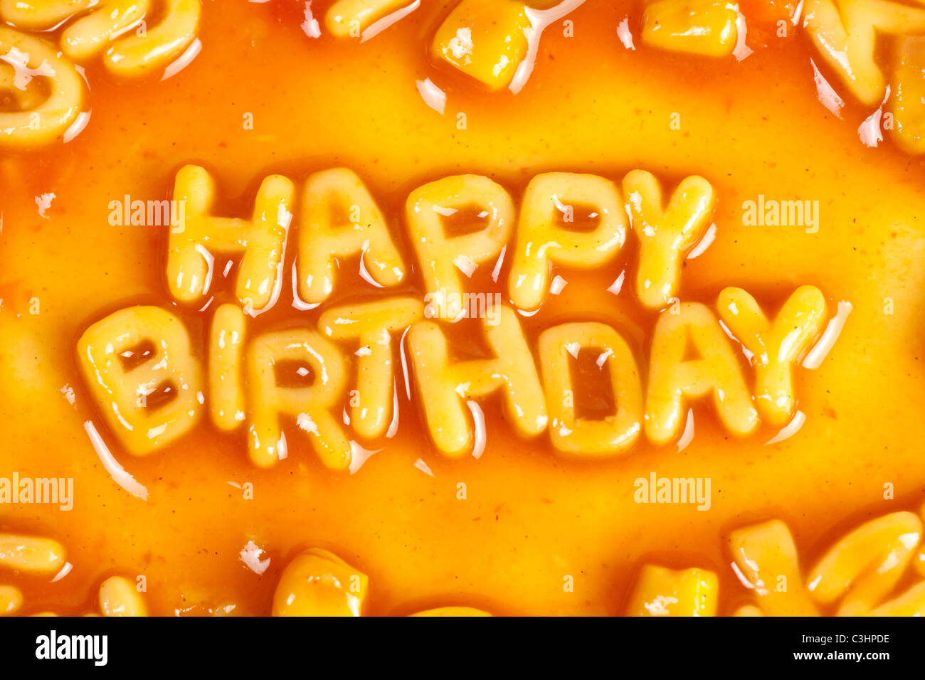 Alphabet shaped pasta forming HAPPY BIRTHDAY in tomato sauce Stock ...