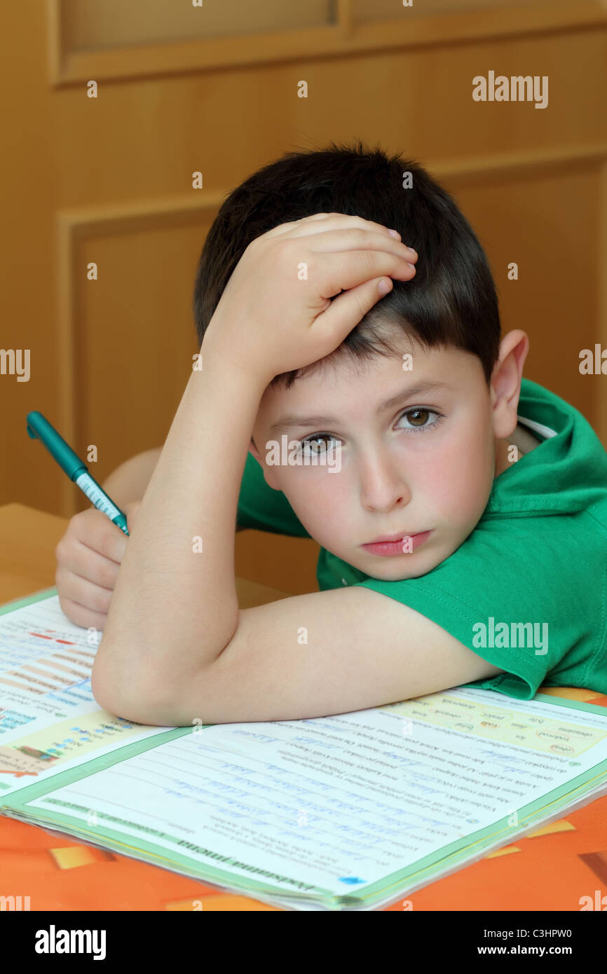 Homework schoolchild workbook boy hi-res stock photography and images ...
