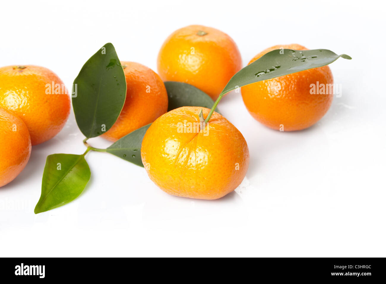 fresh tangerines on the white background Stock Photo - Alamy