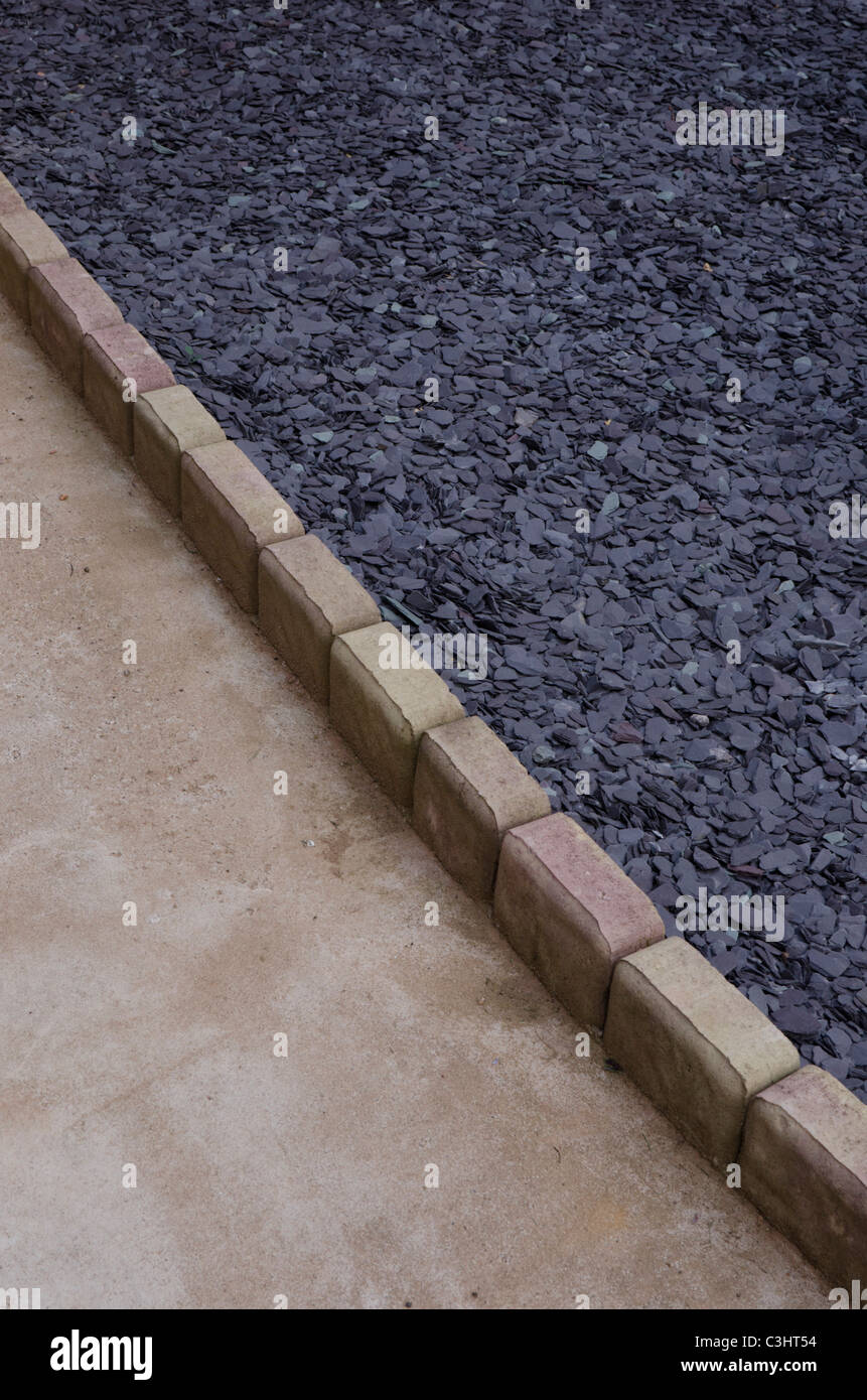 Chipped slate covered ground beside a garden path Stock Photo - Alamy