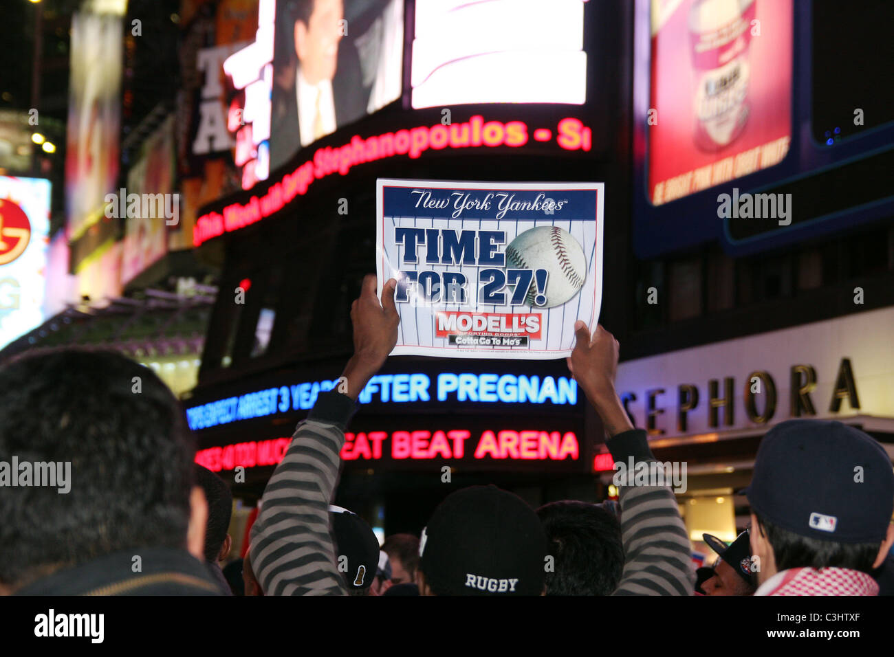 Atmosphere Yankees fans gather together in Times Square to celebrate ...