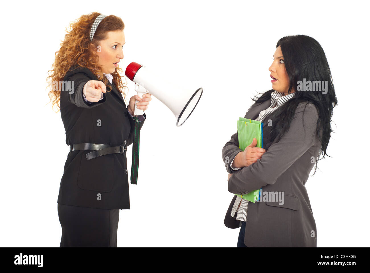 Furious manager woman shouting into megaphone to scared employee woman ...
