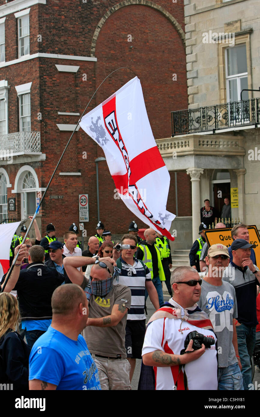 Members of the EDL wave their flags and banners at a demonstration in ...