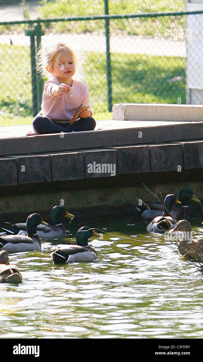 Violet Affleck feeding the ducks on a park pond in Brentwood Los ...