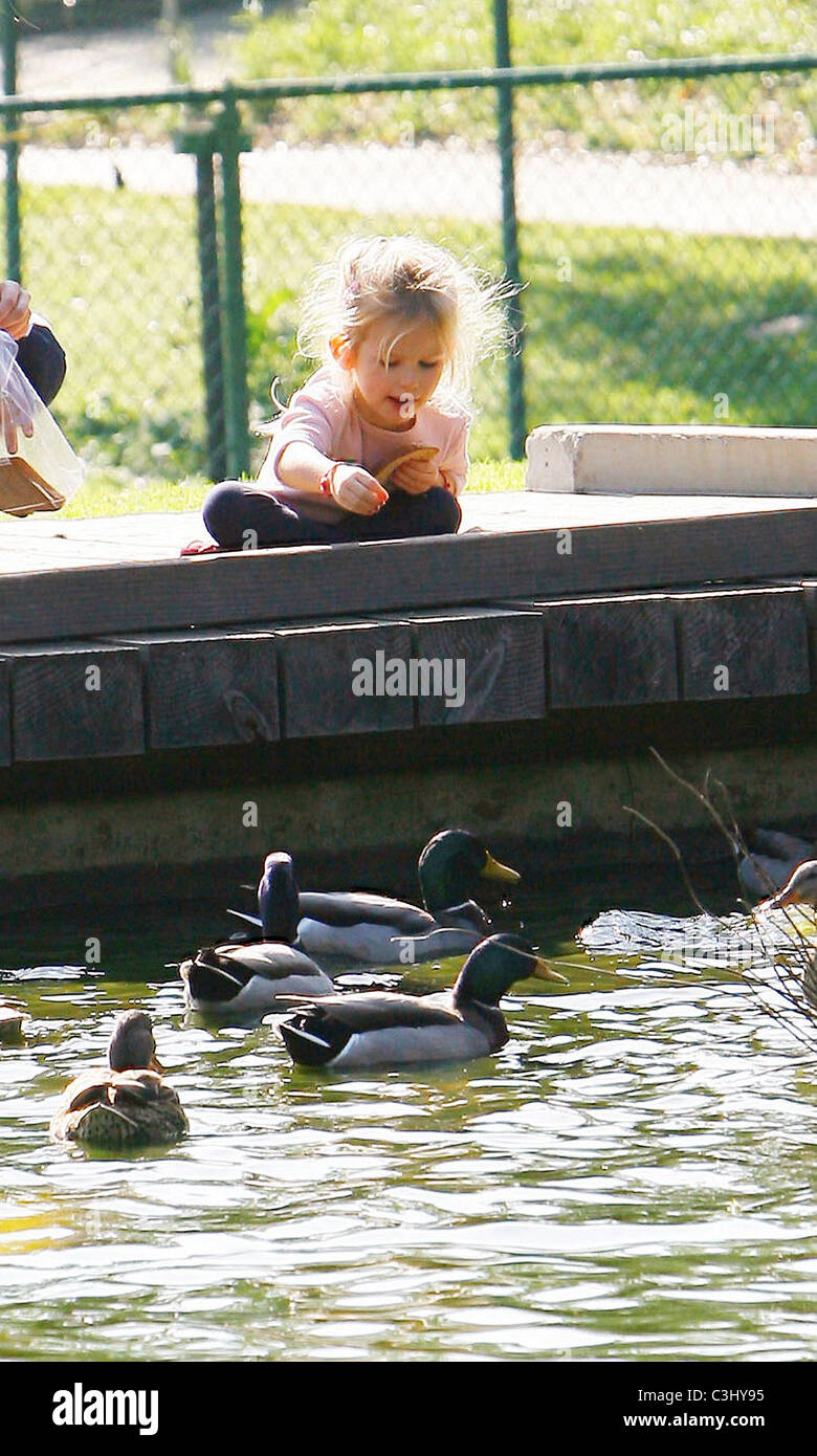 Violet Affleck feeding the ducks on a park pond in Brentwood Los ...