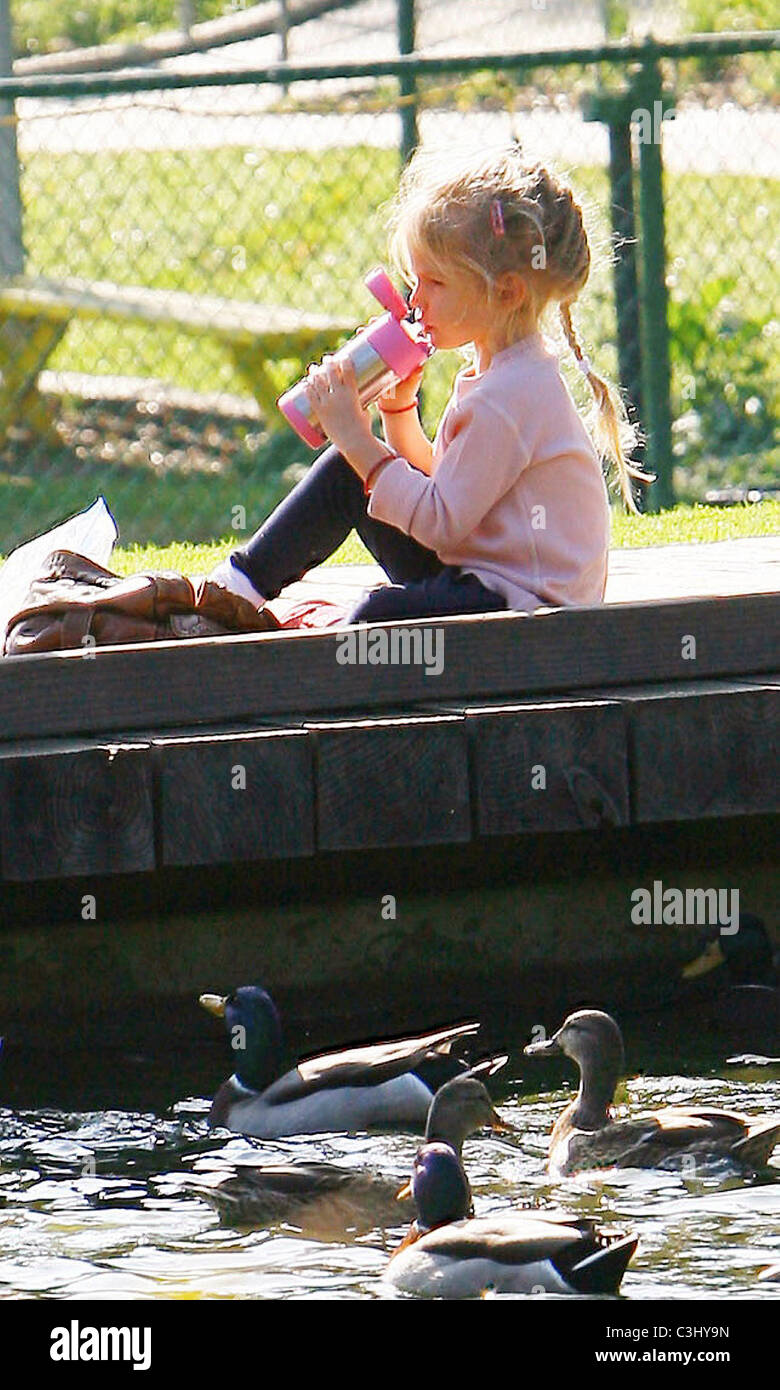 Violet Affleck feeding the ducks on a park pond in Brentwood Los ...