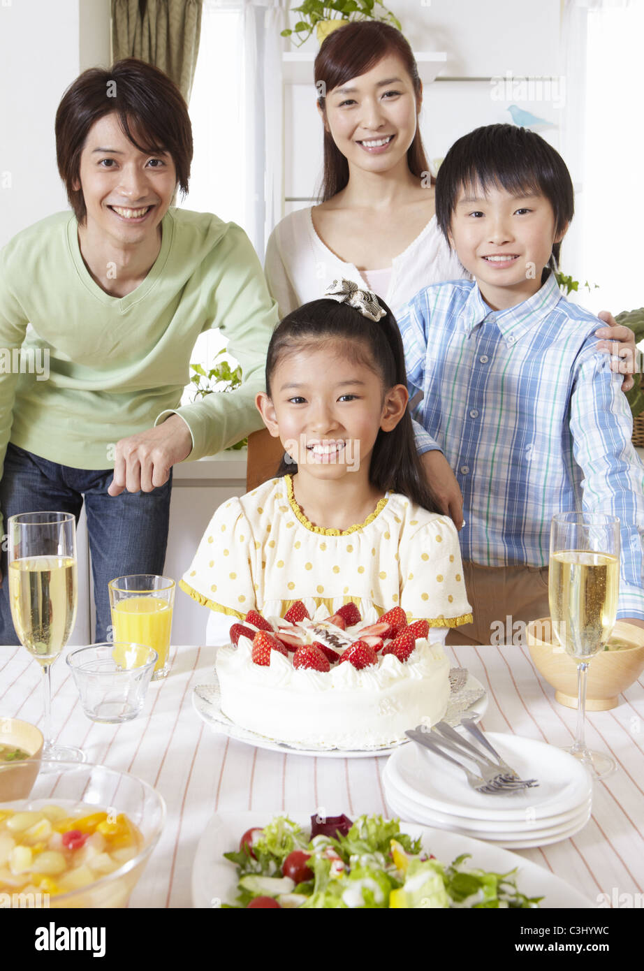 Parents and kids having a birthday party Stock Photo - Alamy
