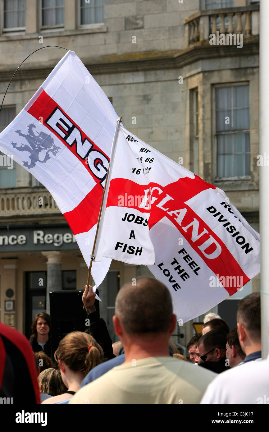 Members of the EDL waving flags and banners at the demonstration Stock ...