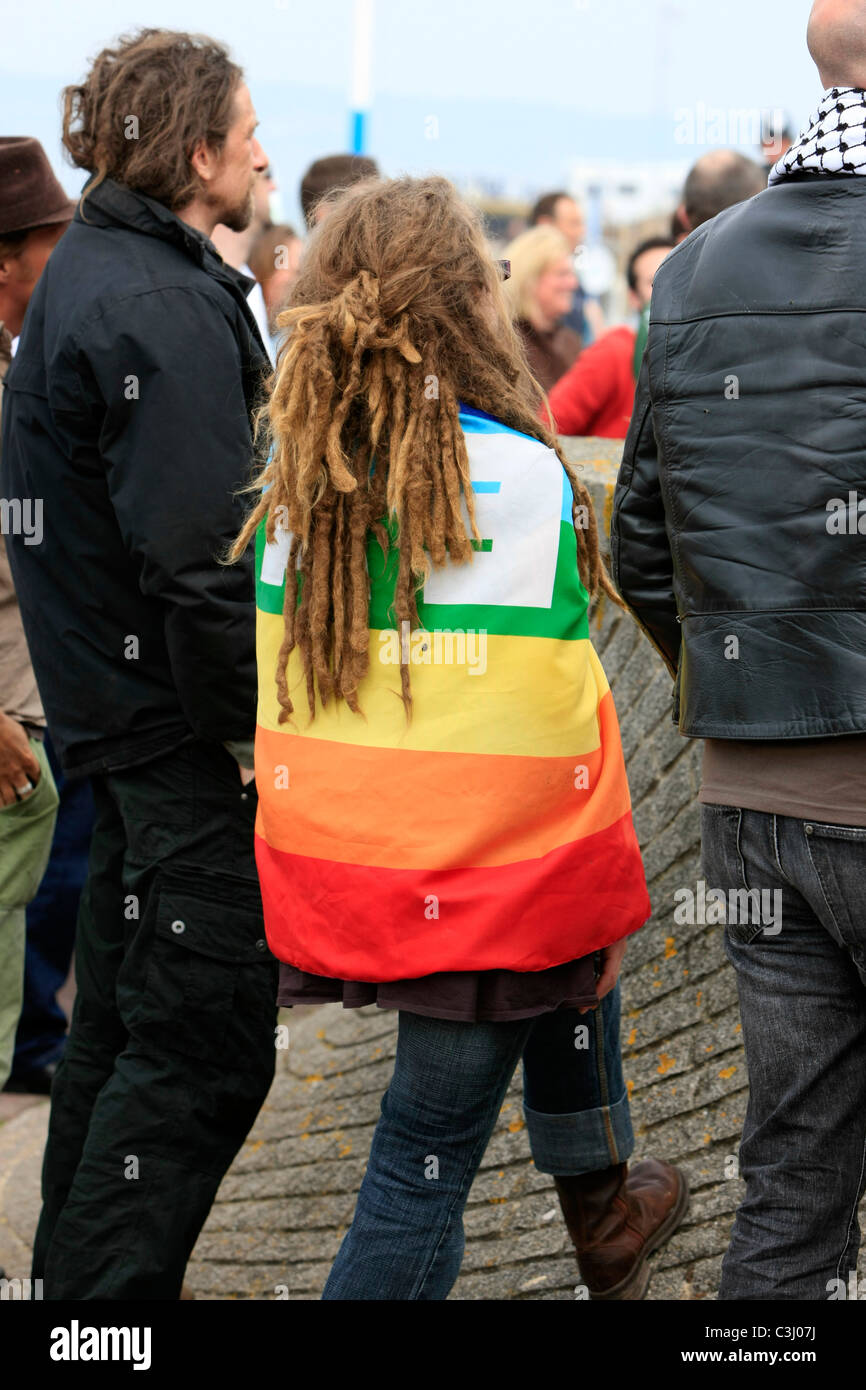 Female member of the AFL draped in her official multi-colored flag ...