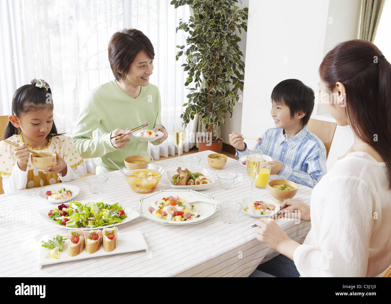 Parents and kids having a party Stock Photo - Alamy