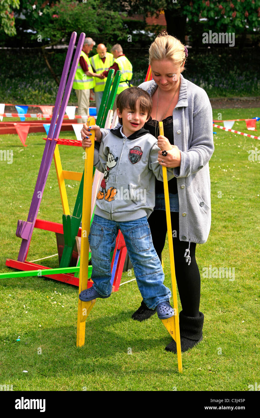 Young boy trying to walk on stilts at a circus workshop day Stock Photo ...