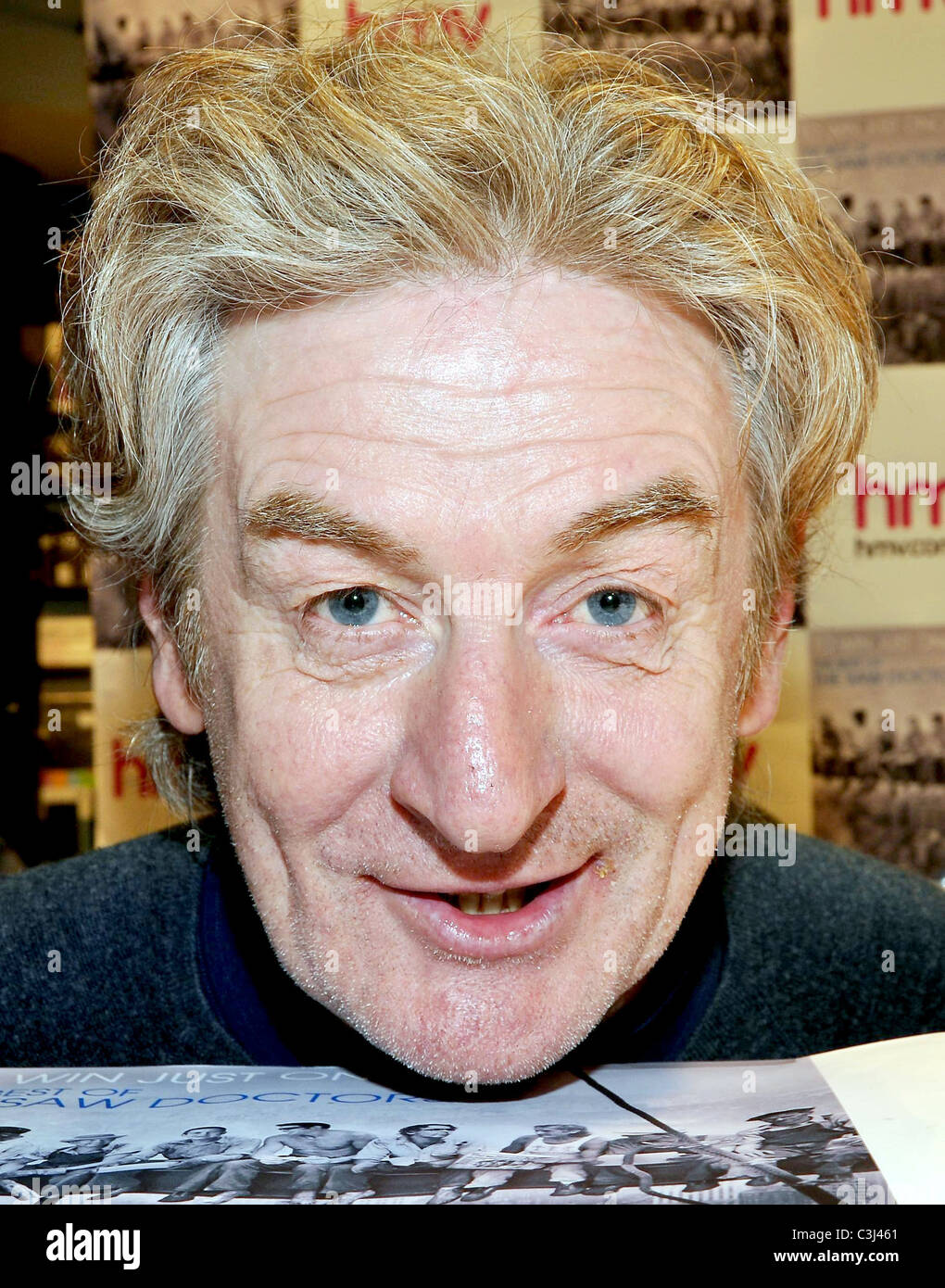 Davy Carton folk rock band The Saw Doctors sign copies of their best of ...