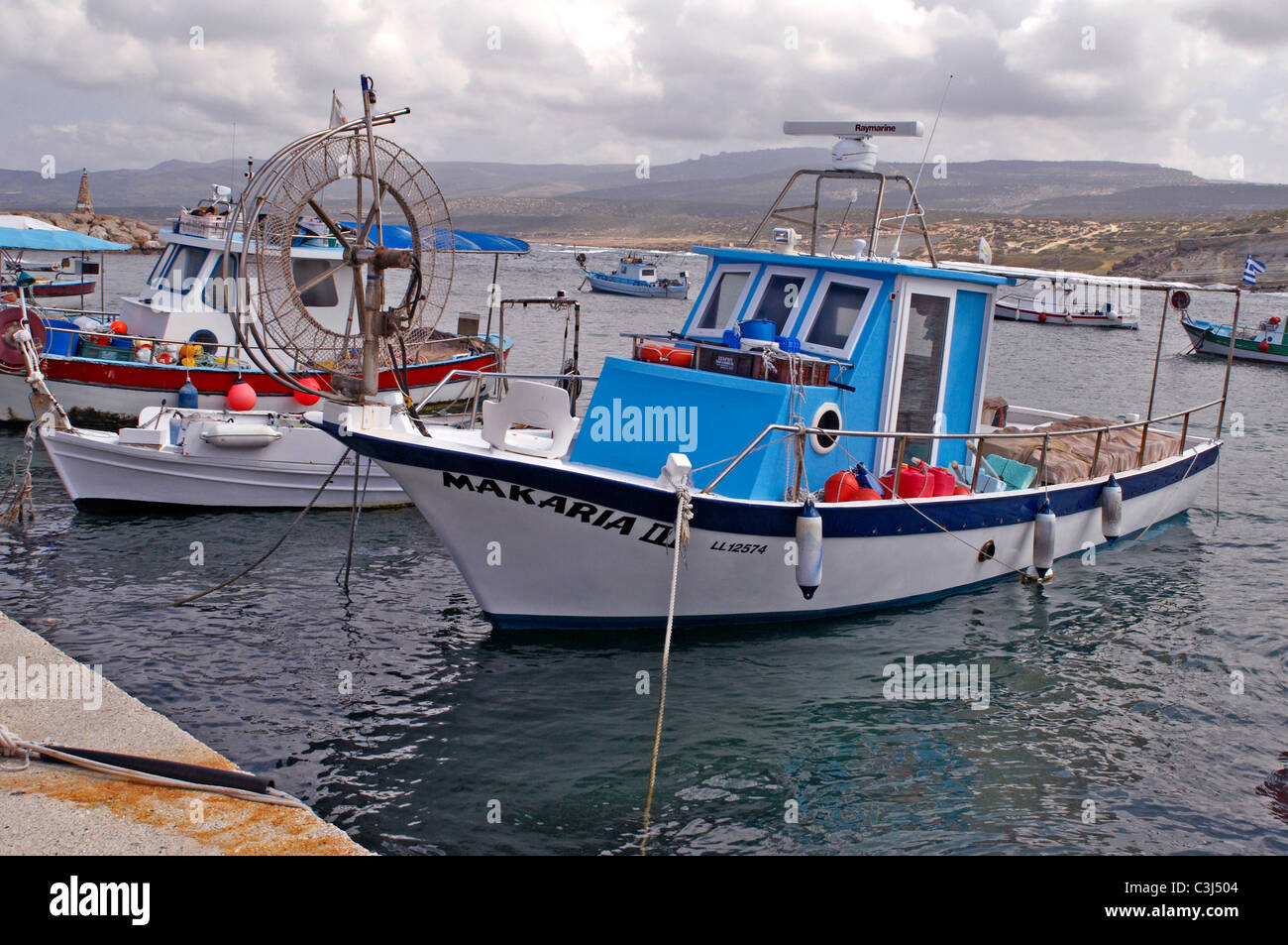 The old Roman fishing harbour at Agios Georgios and Cape Drepano Stock ...