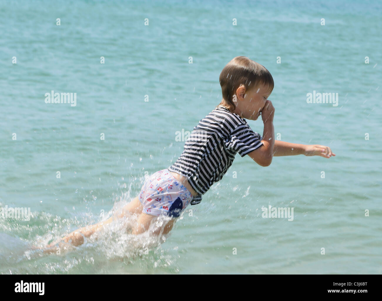 Child jump sea hi-res stock photography and images - Alamy