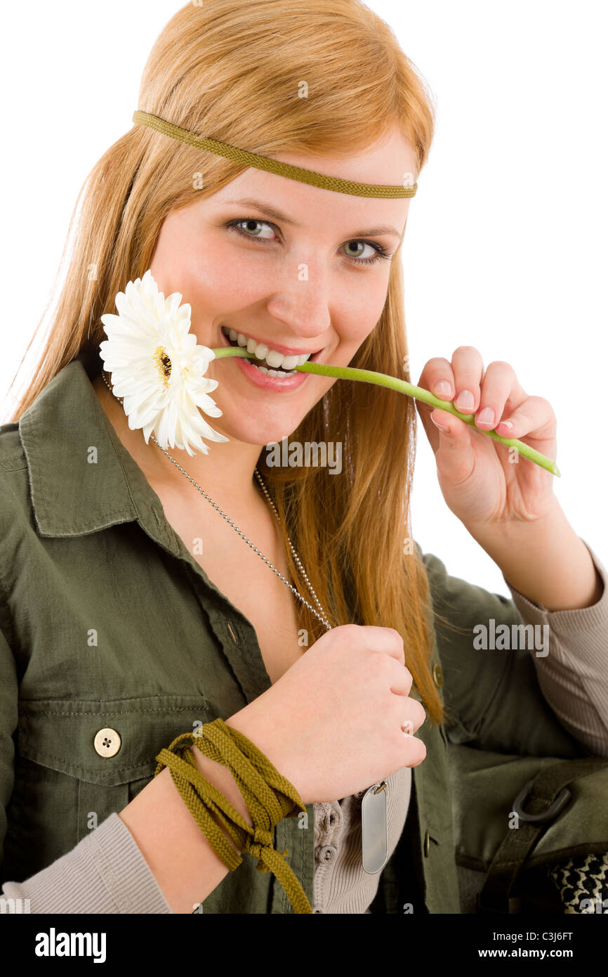 Hippie young happy woman hold gerbera daisy with teeth Stock Photo - Alamy