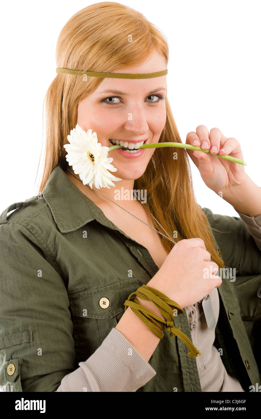 Hippie young happy woman hold gerbera daisy with teeth Stock Photo - Alamy