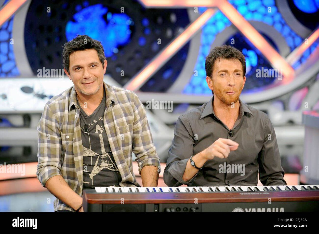 Alejandro Sanz (L) Spanish pop singer is a guest on the television show ...