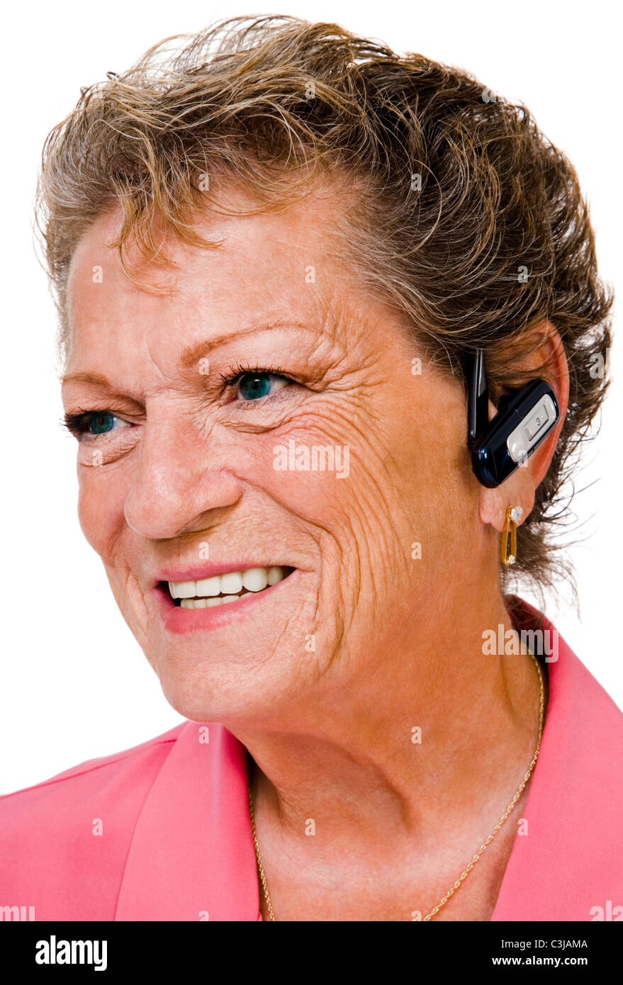 Woman wearing a bluetooth and smiling isolated over white Stock Photo ...