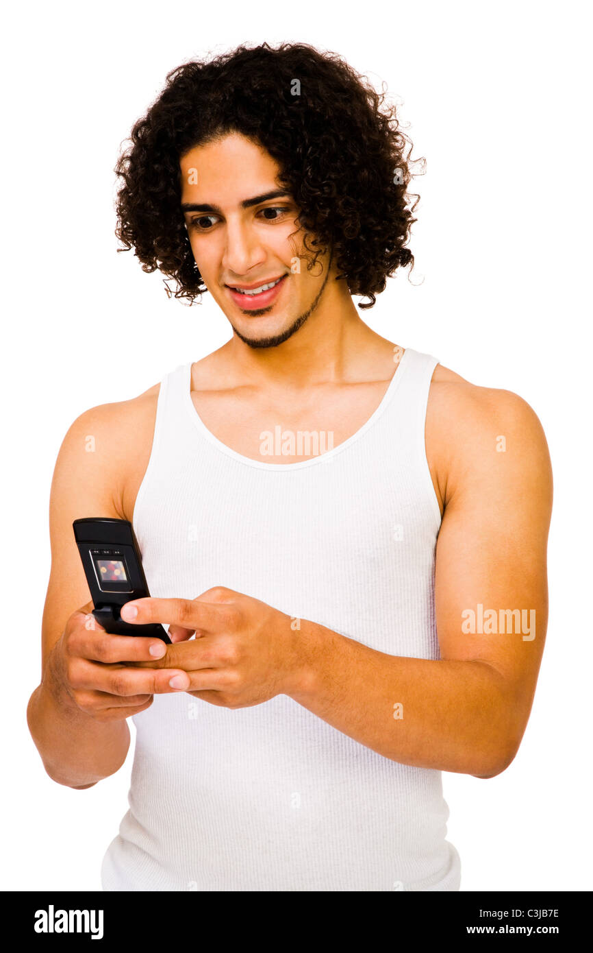 Young man text messaging on a mobile phone isolated over white Stock ...
