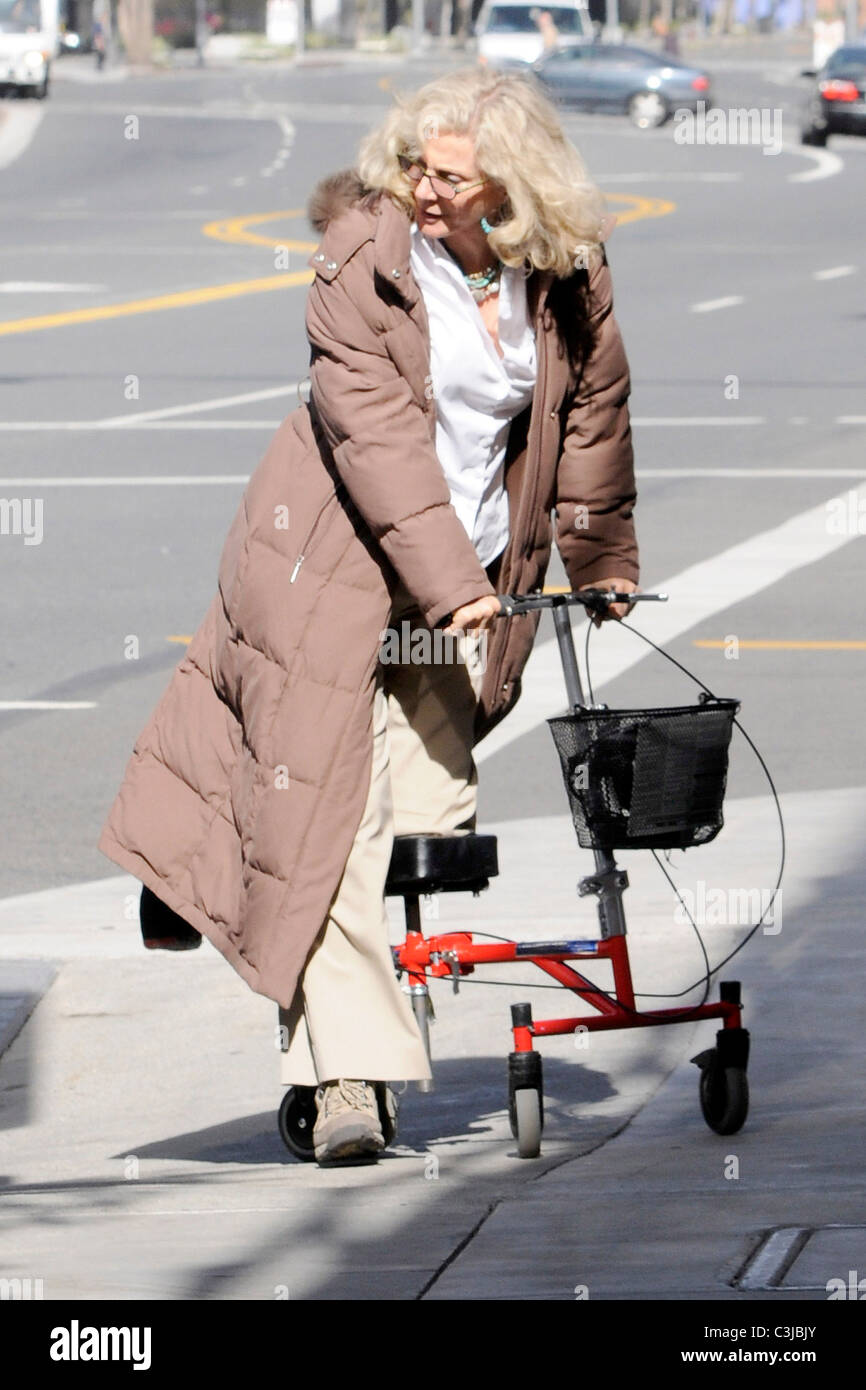 Blythe Danner using a modified walker due to a foot injury while on the ...