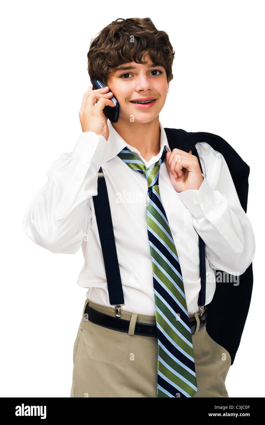 Child talking on a mobile phone and smiling isolated over white Stock ...