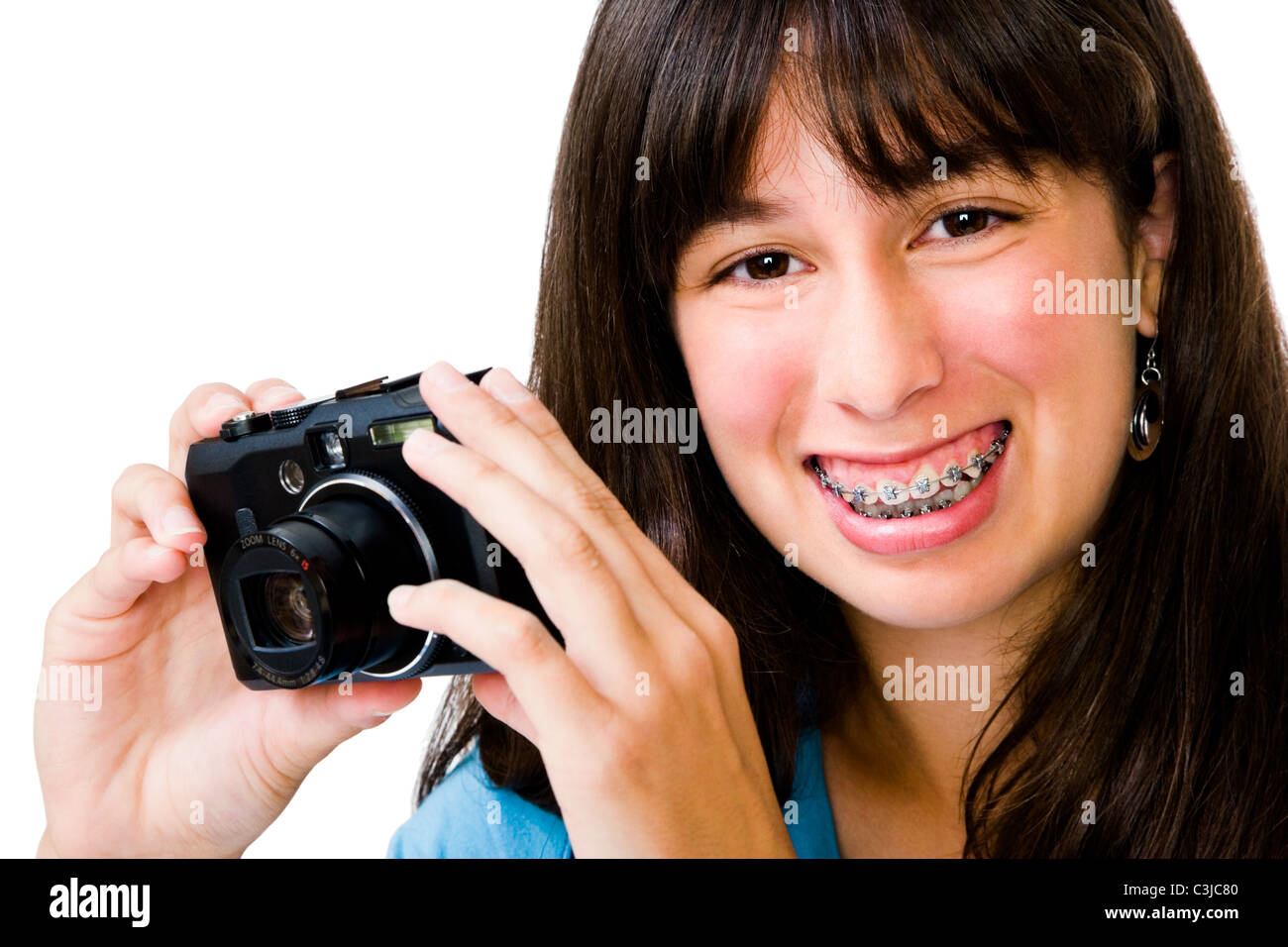 Smiling teenager photographing with a camera isolated over white Stock ...