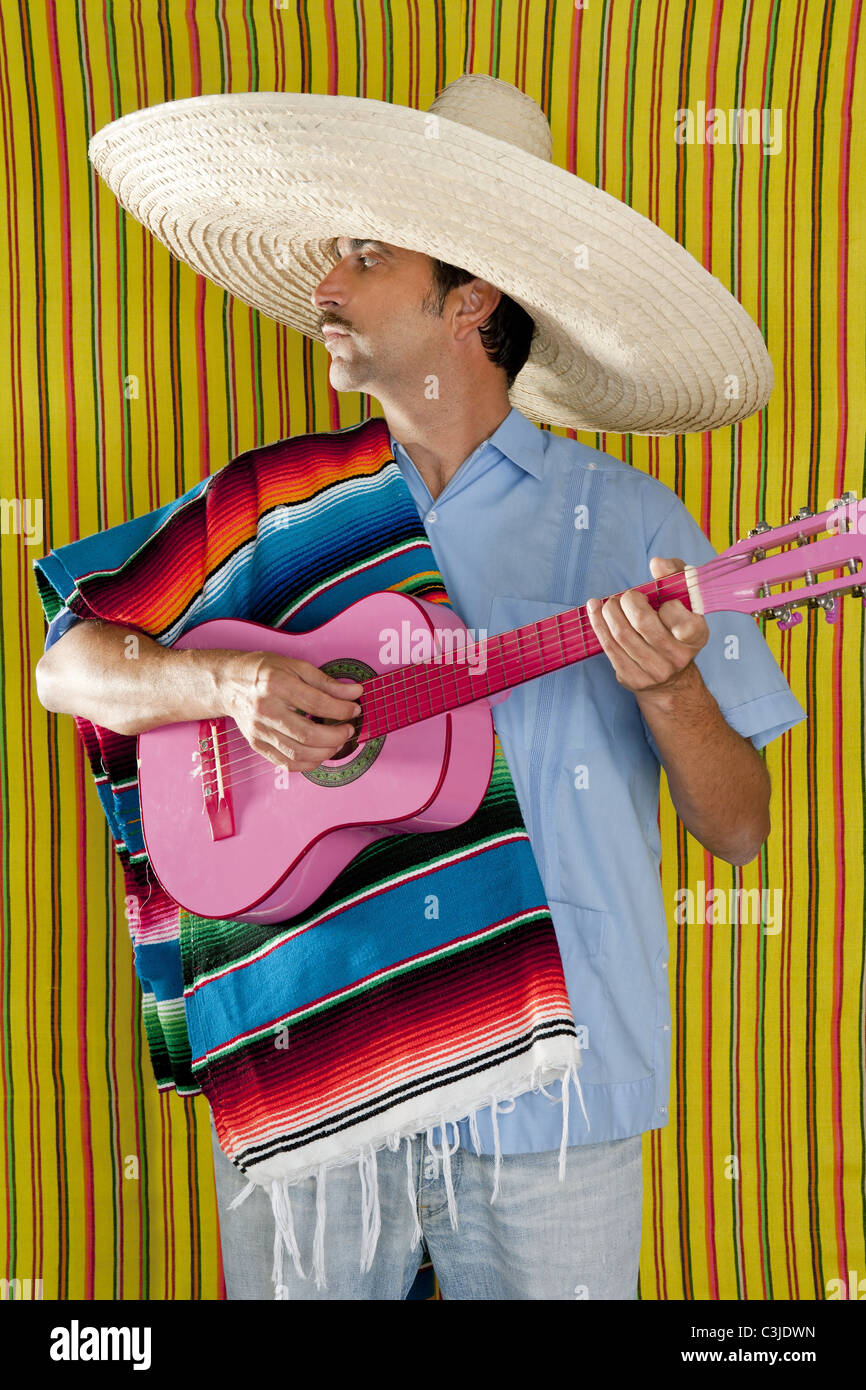 Mexican man serape poncho sombrero playing guitar typical Mexico Stock ...