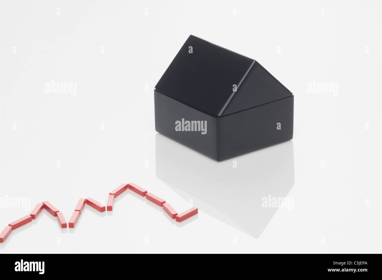 Graph with miniature house on white background Stock Photo - Alamy