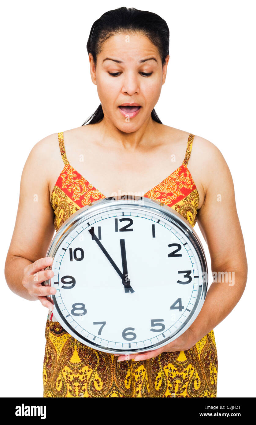 Woman holding clock over face hi-res stock photography and images - Alamy