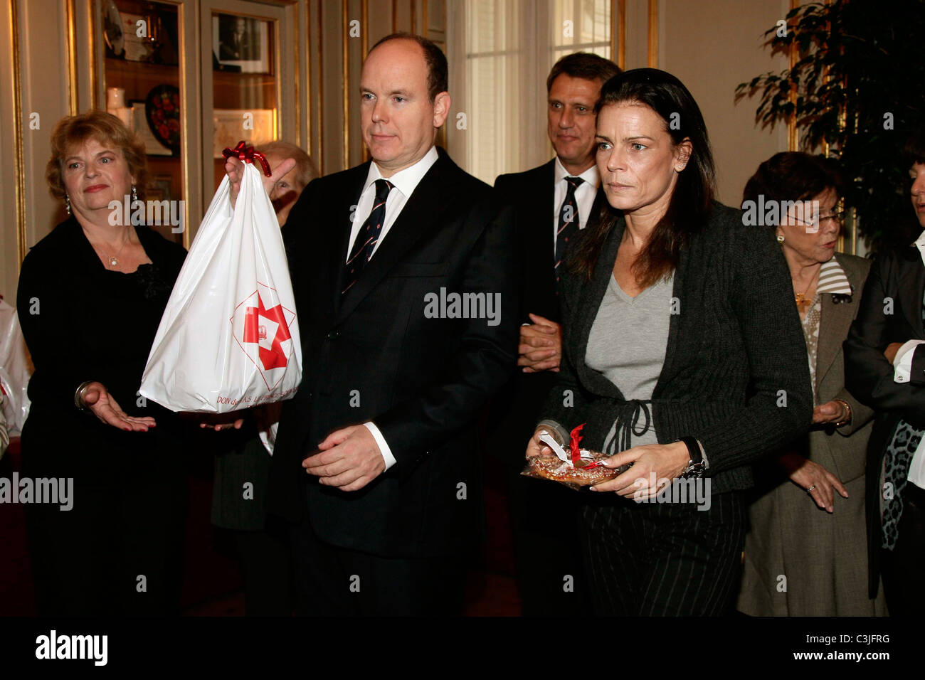 Prince Albert II of Monaco and Princess Stephanie distribute gifts and ...