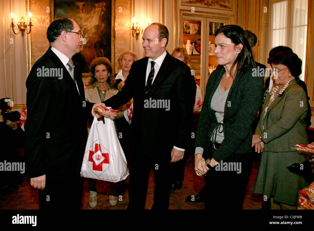 Prince Albert II of Monaco and Princess Stephanie distribute gifts and ...