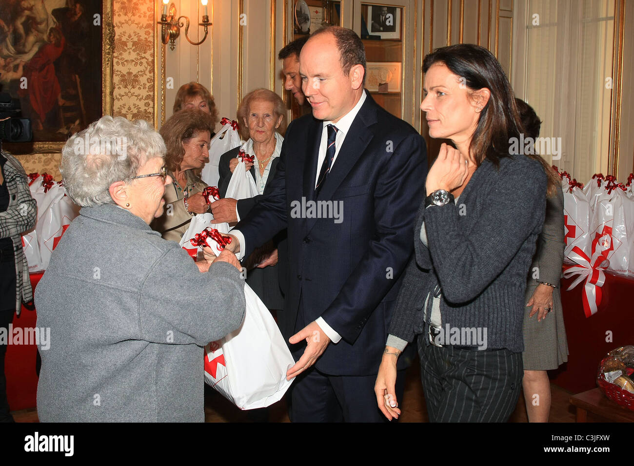 Prince Albert II of Monaco and Princess Stephanie distribute gifts and ...