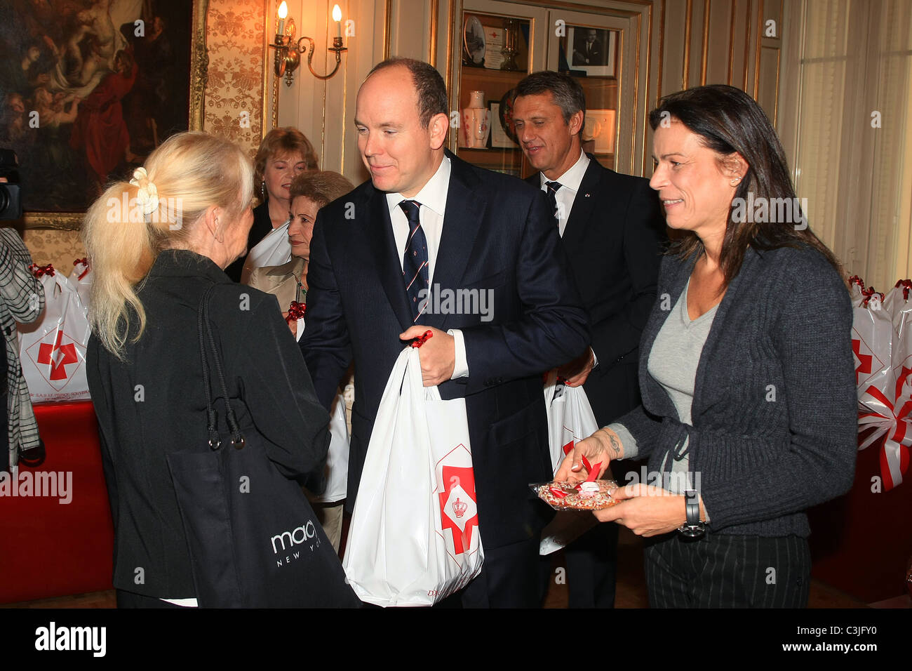 Prince Albert II of Monaco and Princess Stephanie distribute gifts and ...