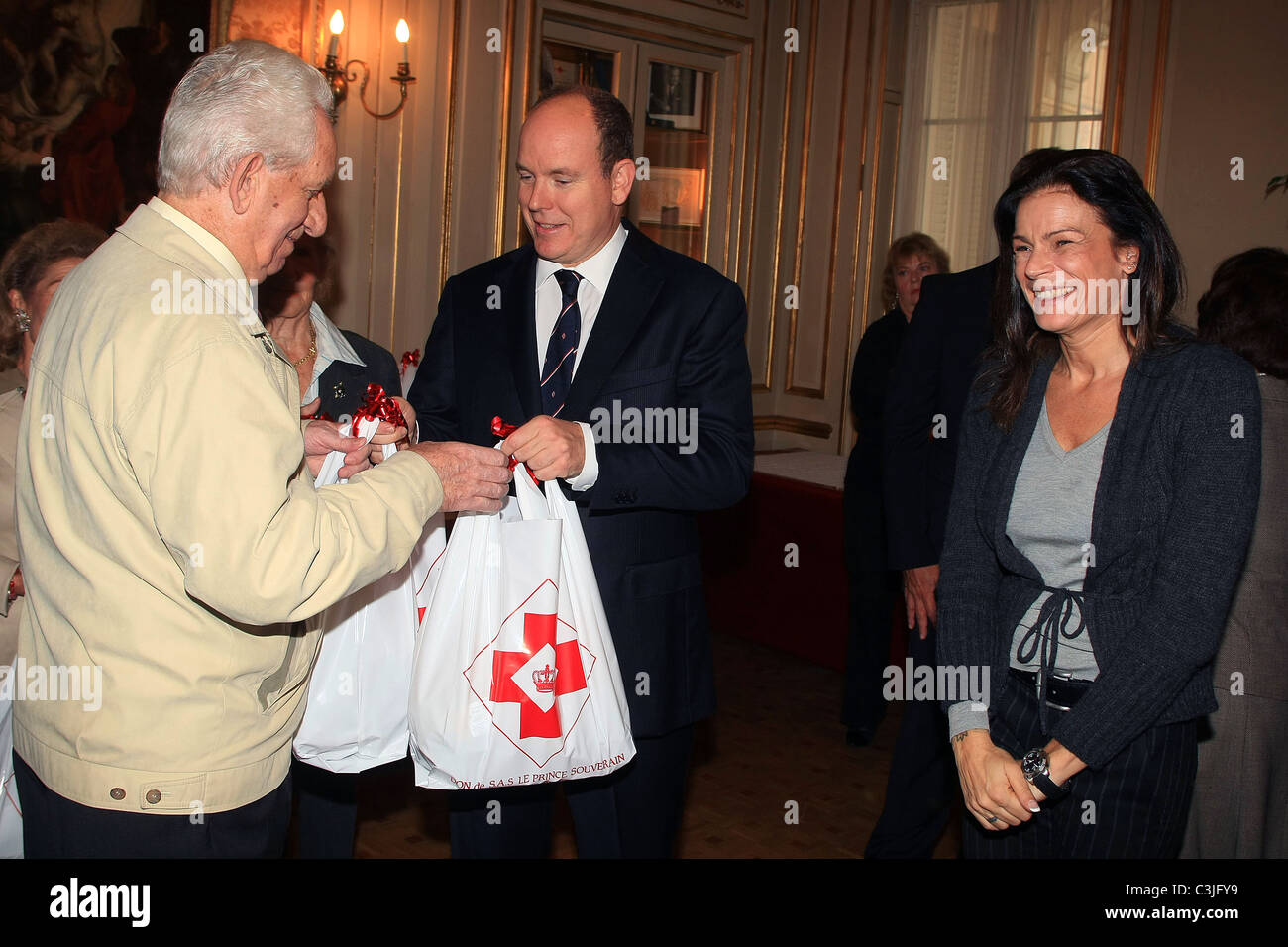 Prince Albert II of Monaco and Princess Stephanie distribute gifts and ...