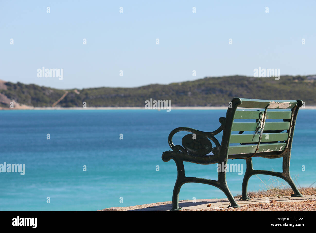 A bench overlooking a beautiful beach Stock Photo - Alamy