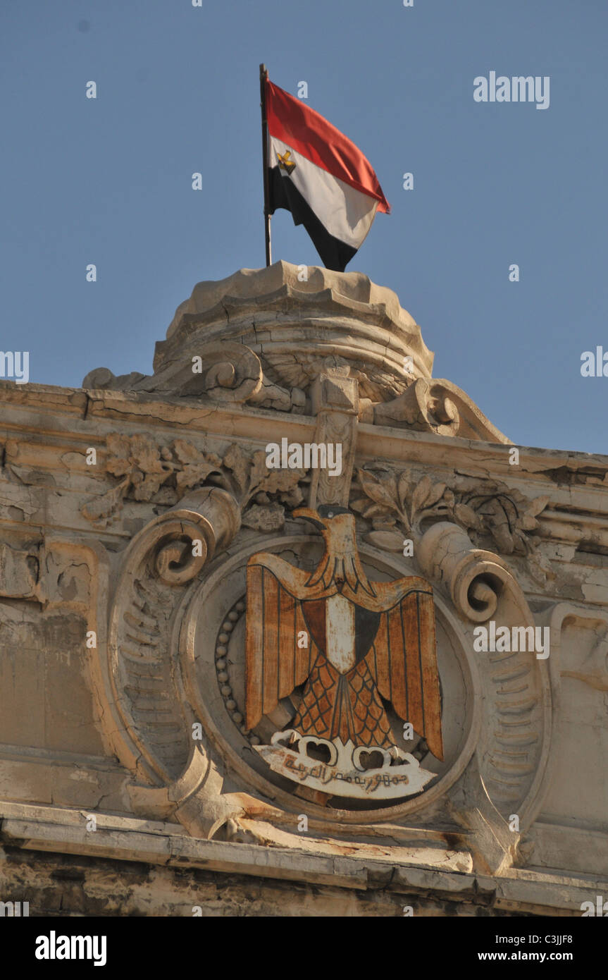 The Egyptian flag flies over the roof and national crest of the main ...