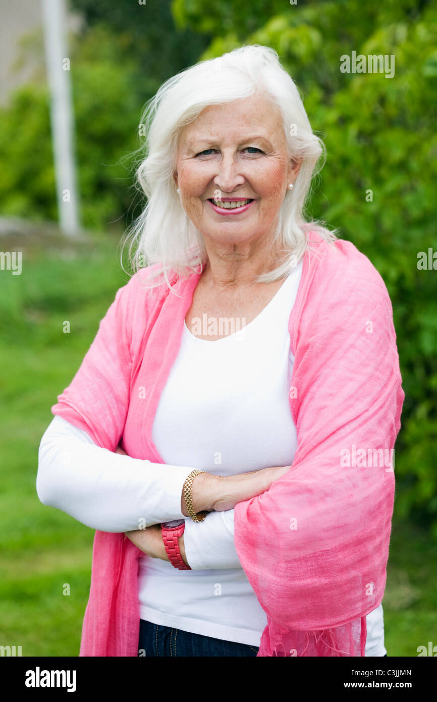 Portrait of senior woman smiling Stock Photo - Alamy